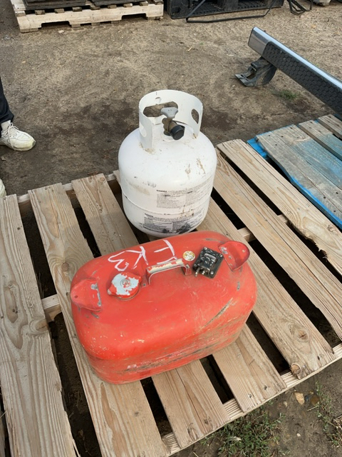 One propane tank, one boat gas tank