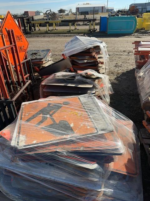 Three pallets of steel road signs and stands